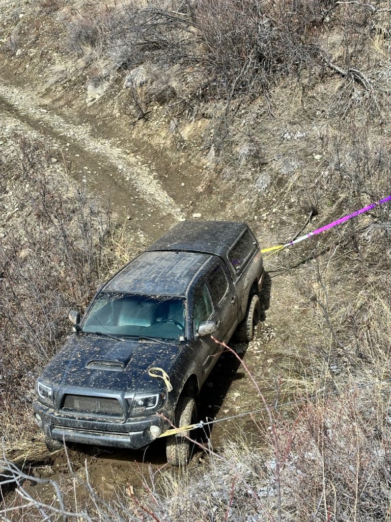 Toyota Tacoma high centered in mud - Offroad Portal