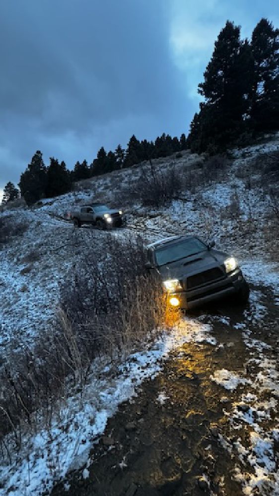 Toyota Tacoma high centered in mud - Offroad Portal