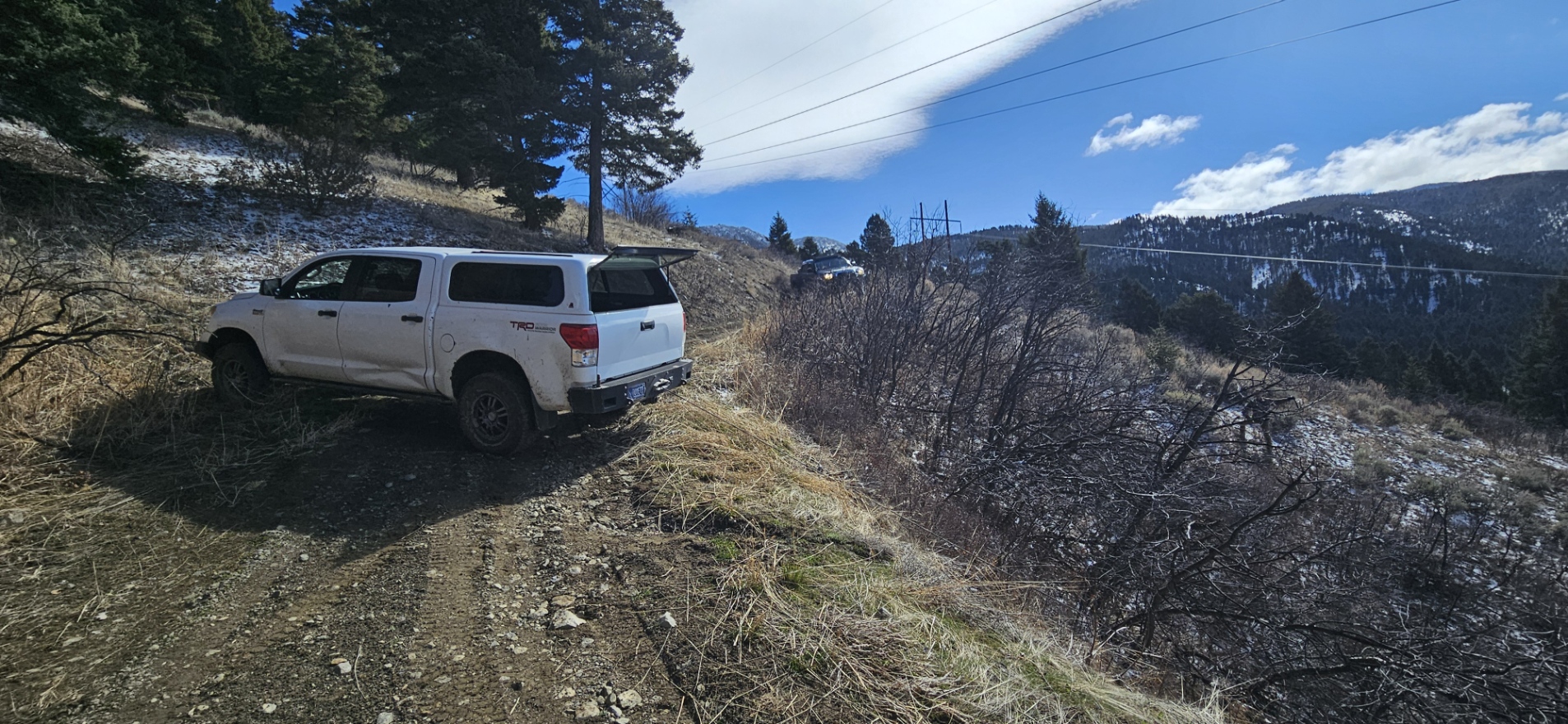Toyota Tacoma high centered in mud - Offroad Portal