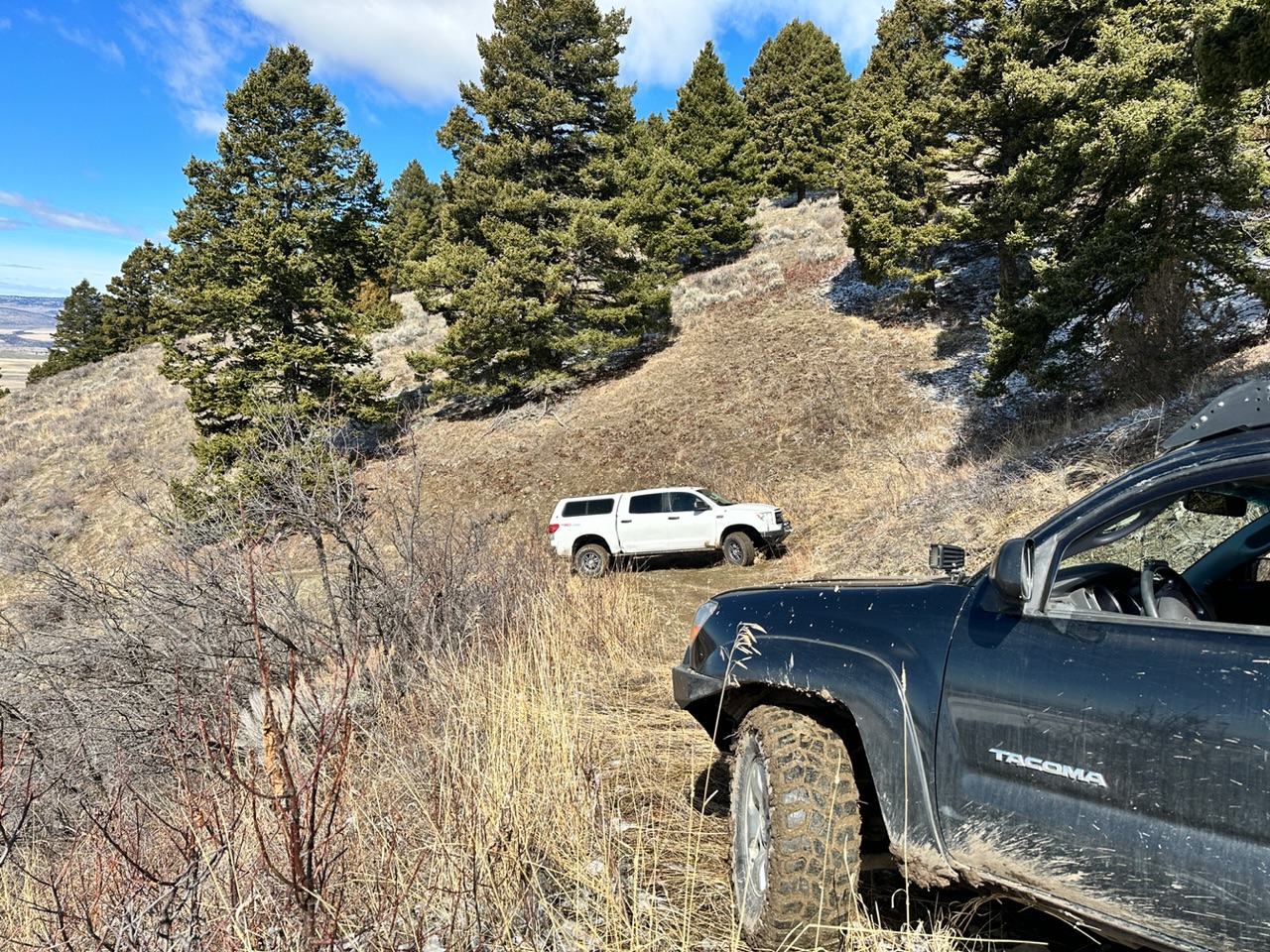 Toyota Tacoma high centered in mud - Offroad Portal