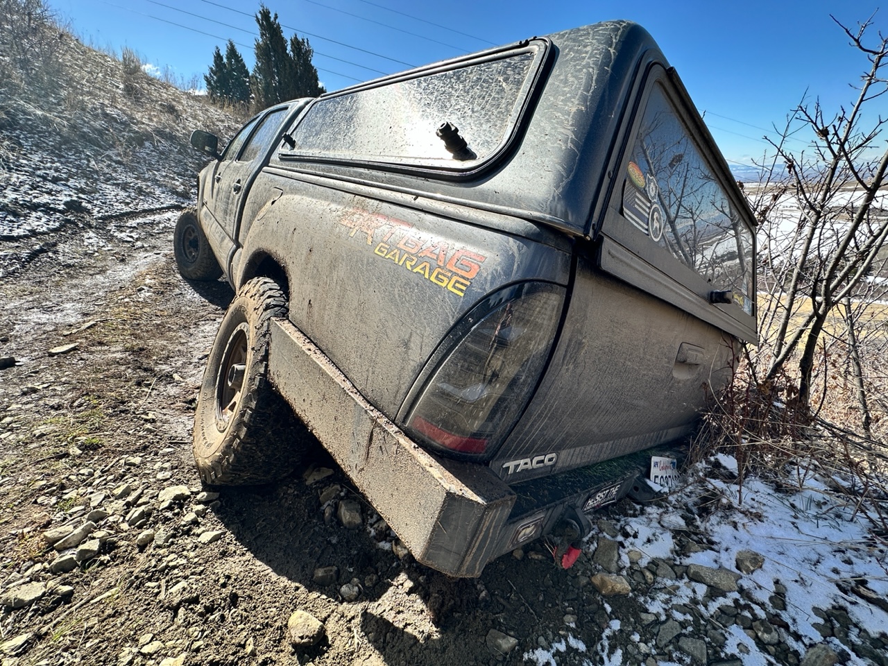 Toyota Tacoma high centered in mud - Offroad Portal