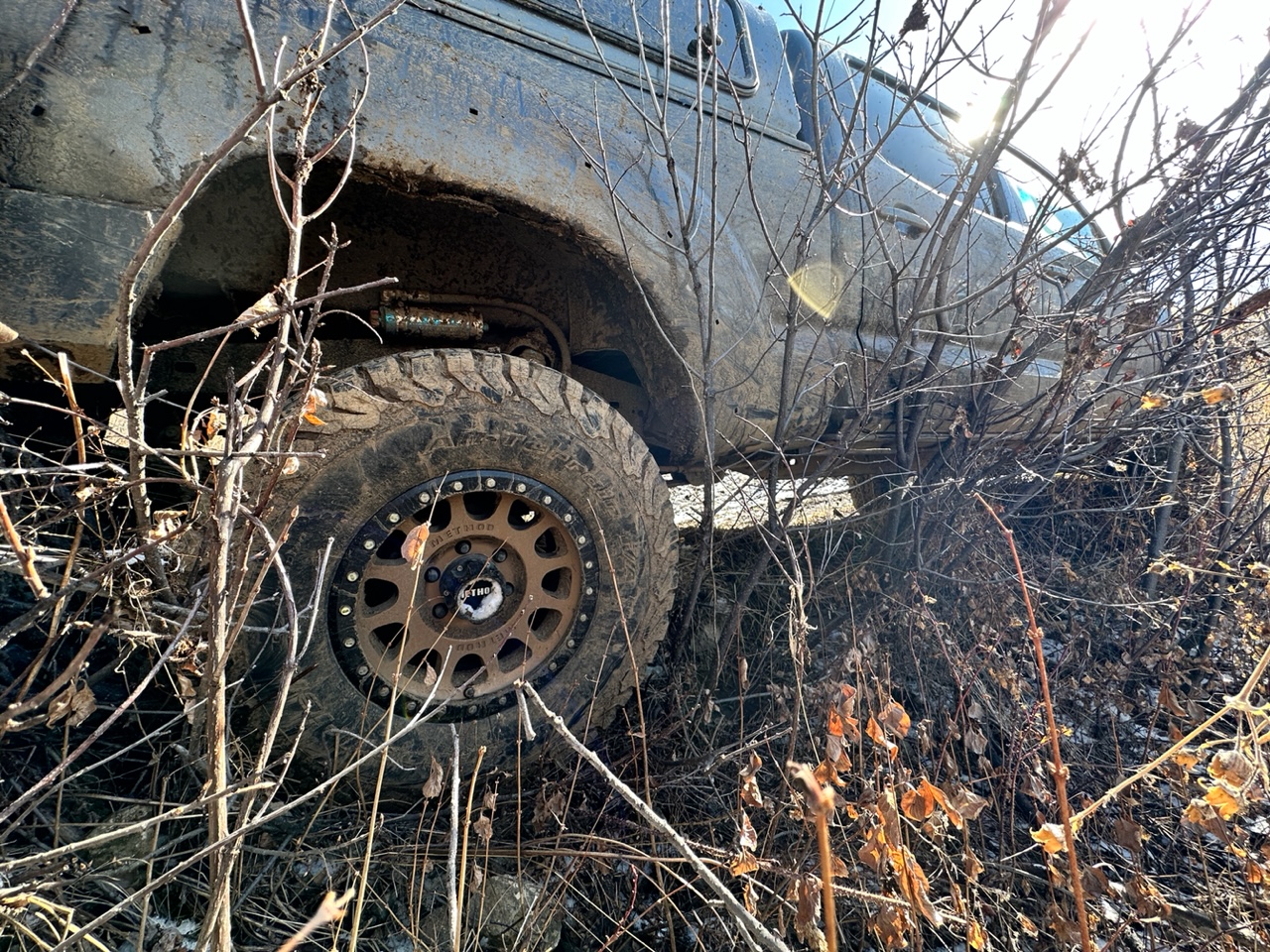 Toyota Tacoma high centered in mud - Offroad Portal
